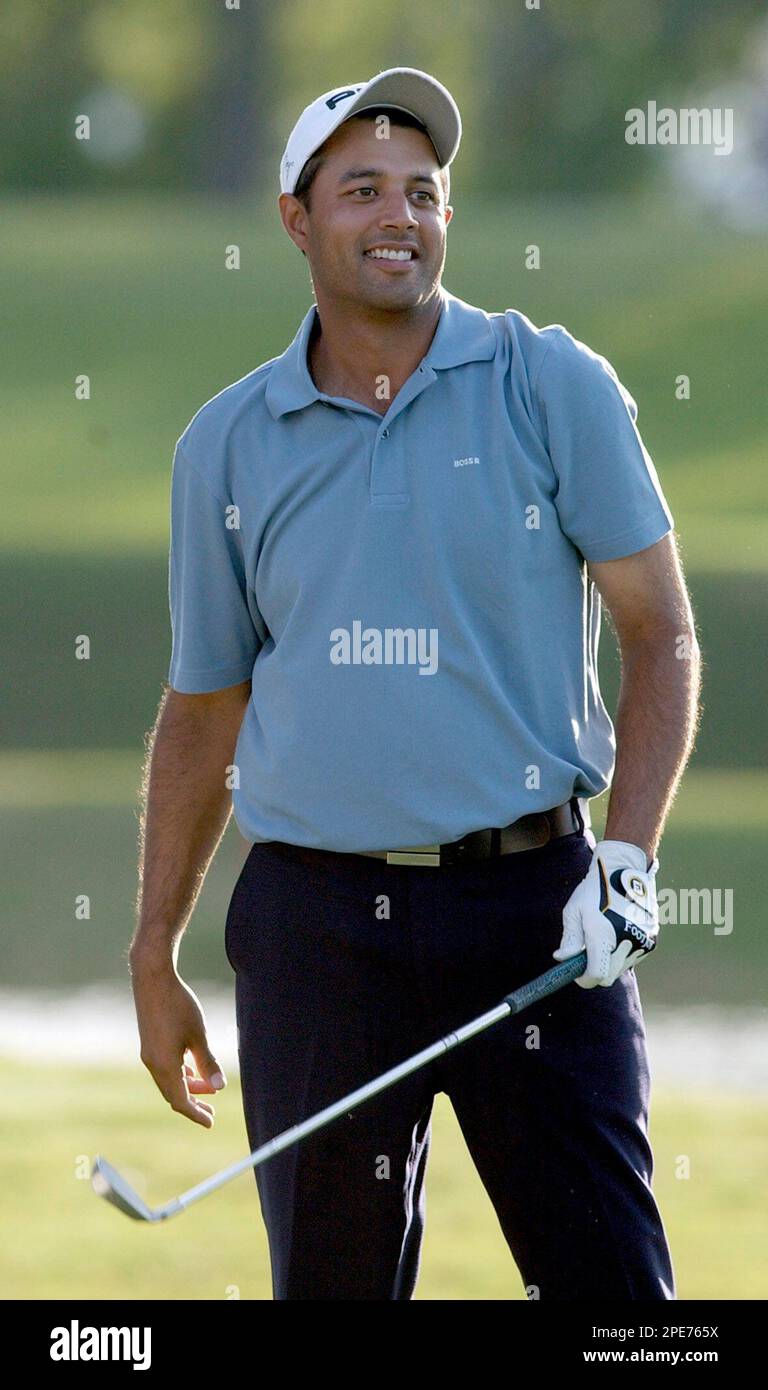 Arjun Atwal of India smiles after hitting his tee shot to the ninth ...