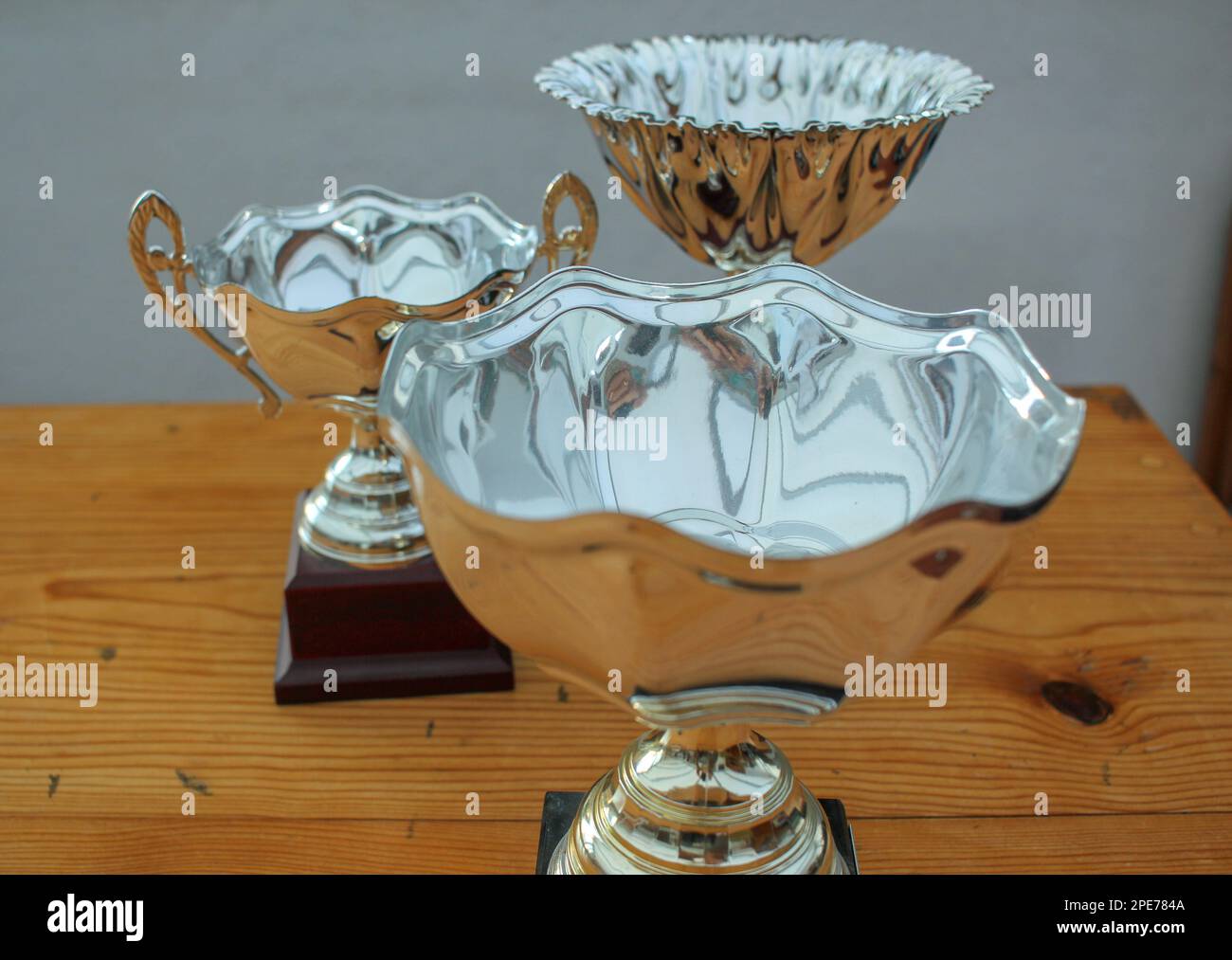 silver cups for the best in each field Stock Photo - Alamy