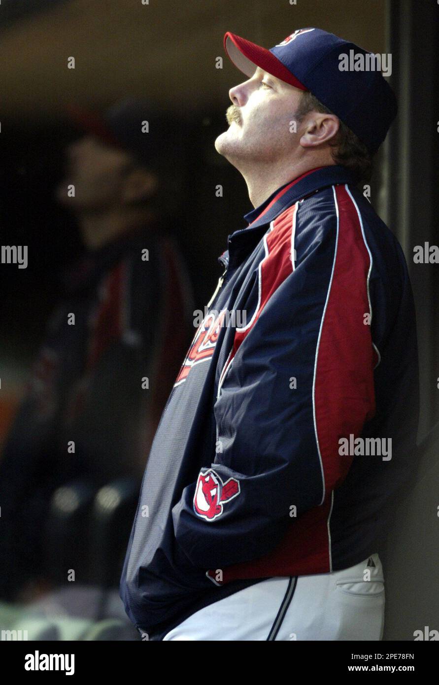 Cleveland Indians manager Eric Wedge closes his eyes and leans back in ...