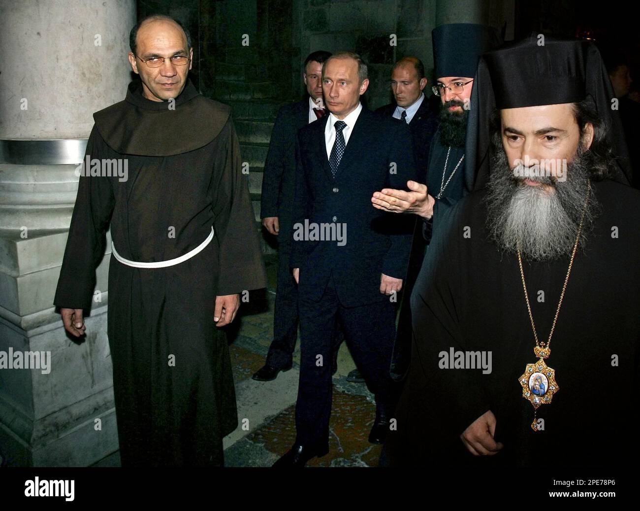 Russian President Vladimir Putin, second left, visits the Church of the ...