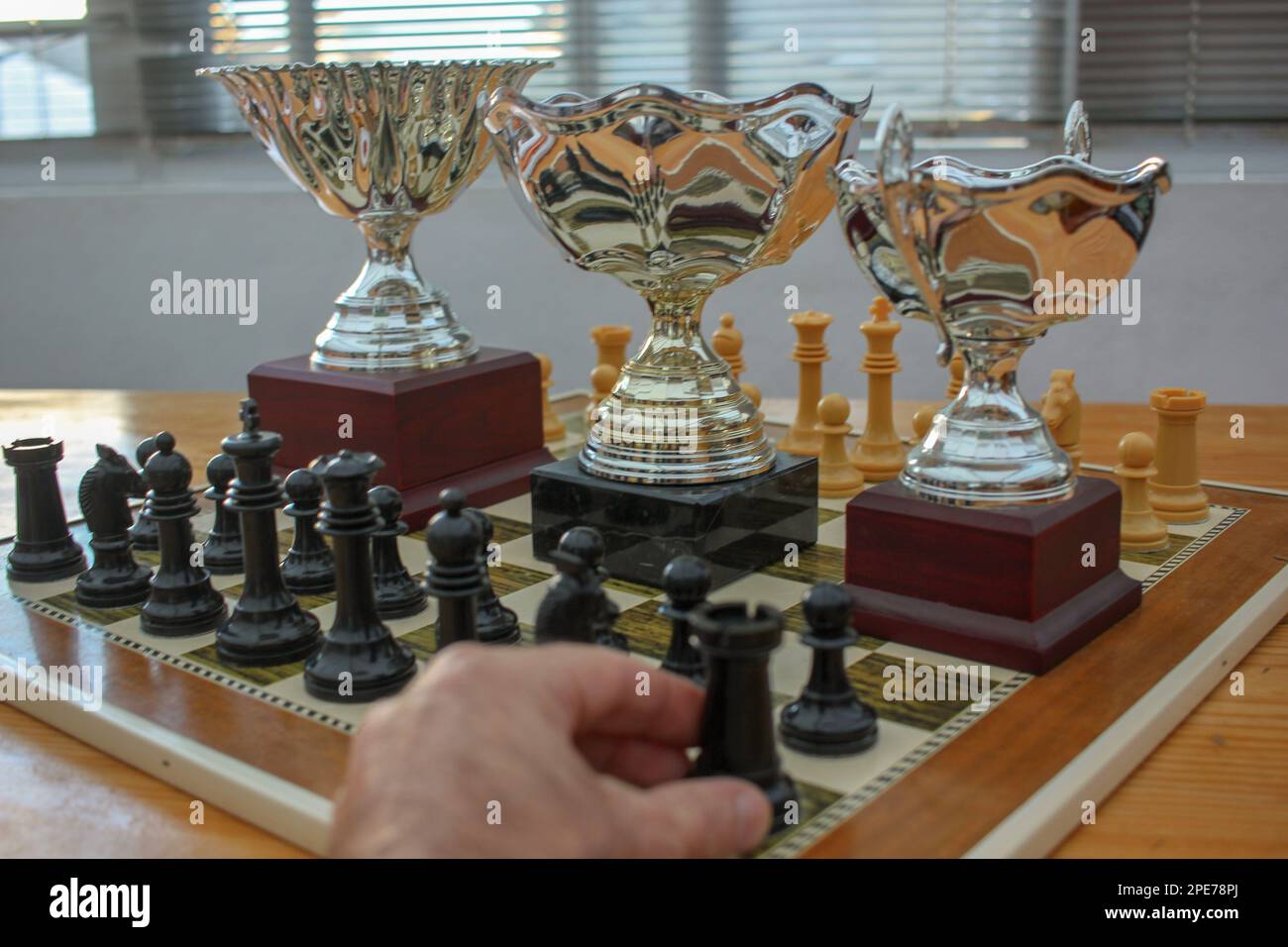 moving the pieces to win the trophy Stock Photo - Alamy