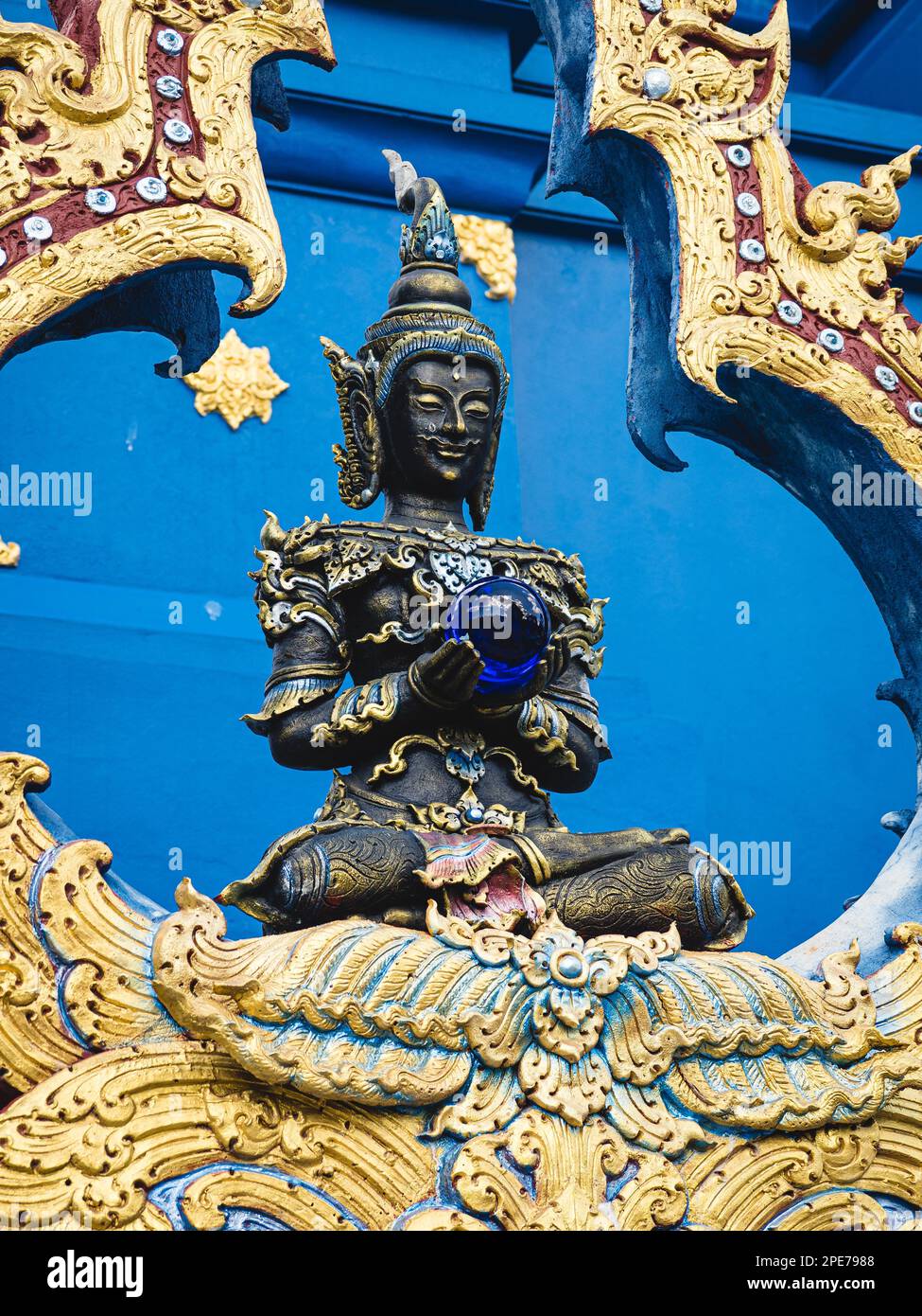 The blue god spirit Buddhist deity at Chiang Rai's Wat Rong Suea Ten ...