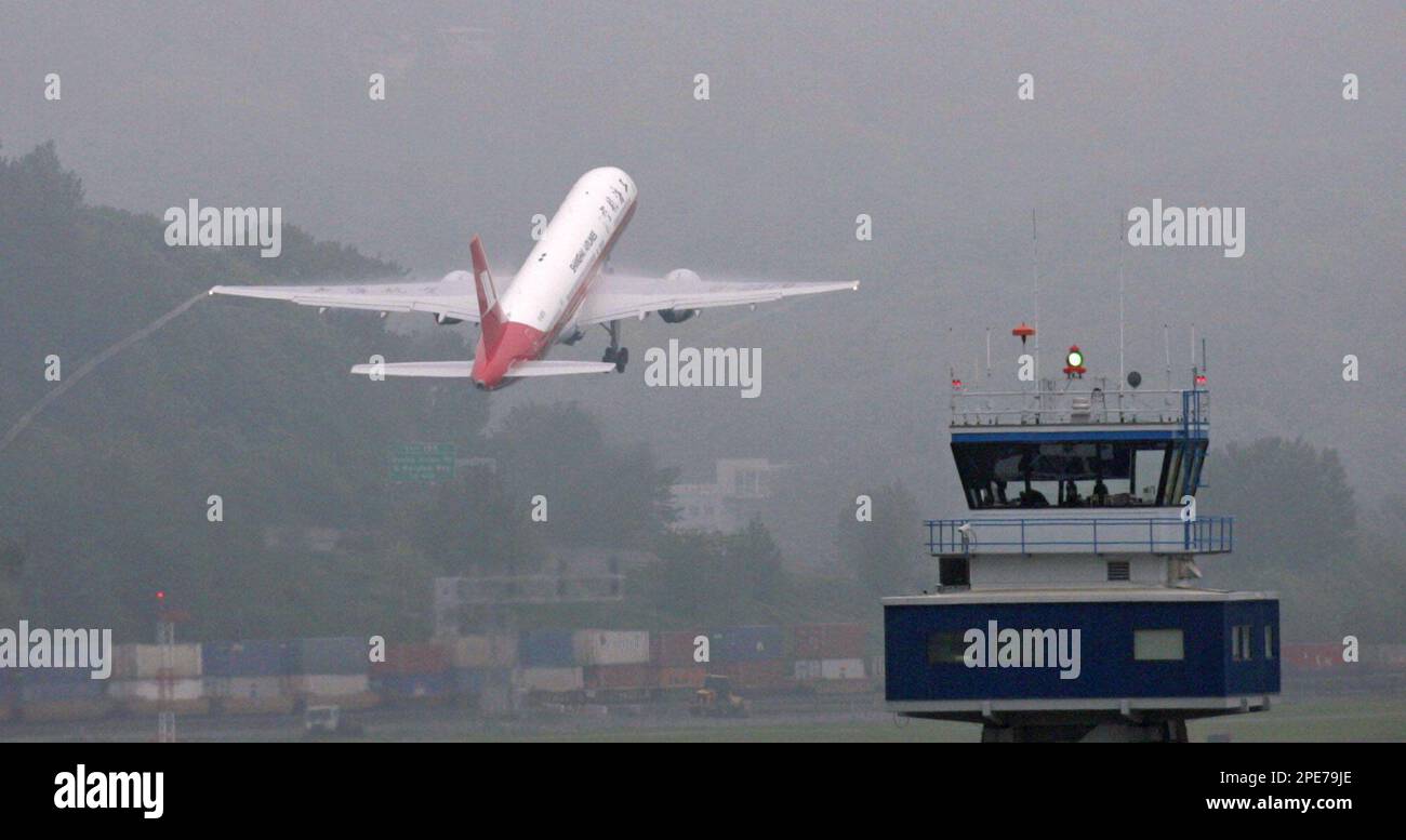 The final Boeing 757 built by The Boeing Co. flies past the control ...