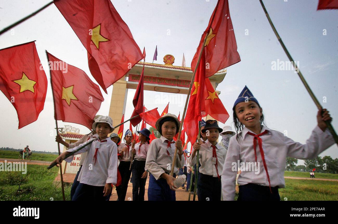 Vietnamese school children carry flags during a landmine awareness ...