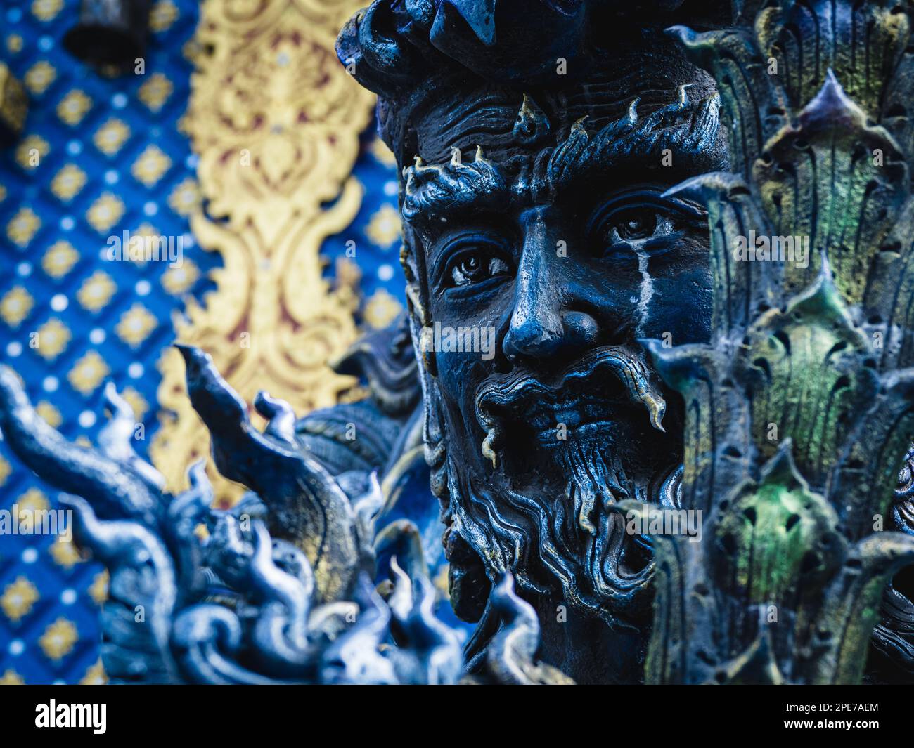 The blue god spirit Buddhist deity at Chiang Rai's Wat Rong Suea Ten ...
