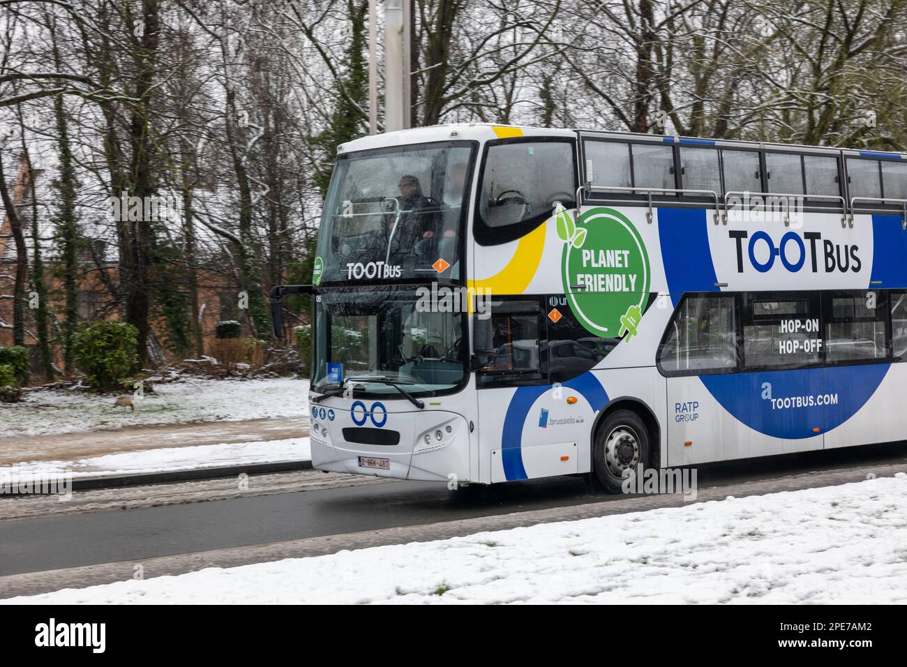 Tootbus taking tourists around Brussels in the winter snow Stock Photo ...