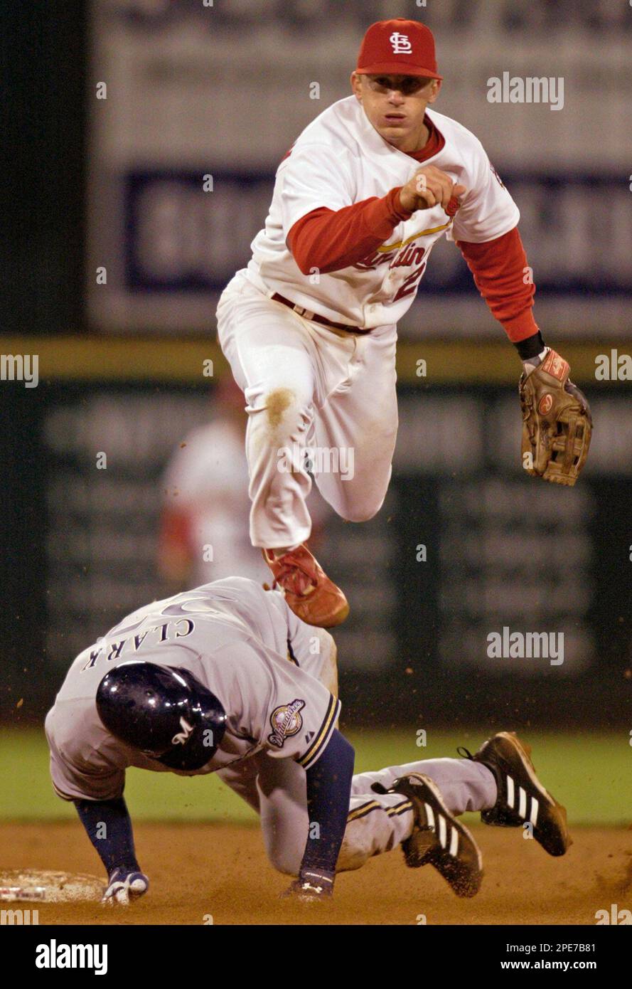 St. Louis Cardinals David Eckstein leaps to avoid Milwaukee Brewers's ...