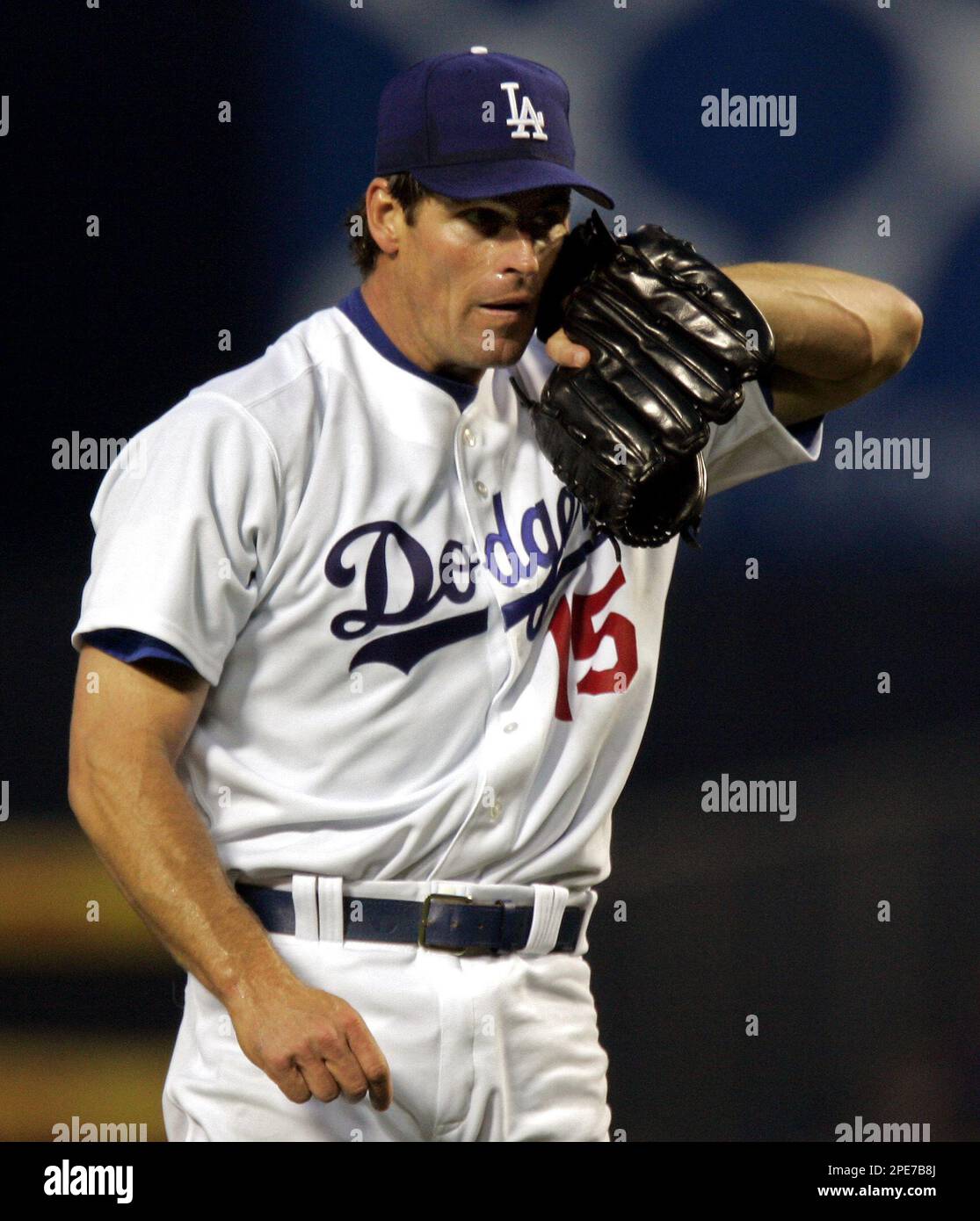 Los Angeles Dodgers' pitcher Scott Erickson wipes his face after giving ...