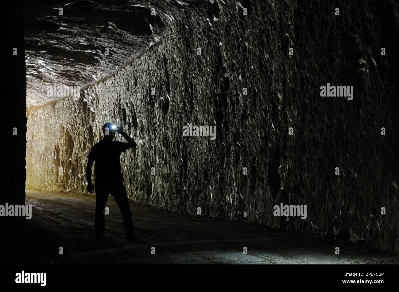 Speleologist enters abandoned cave, Italy Stock Photo - Alamy