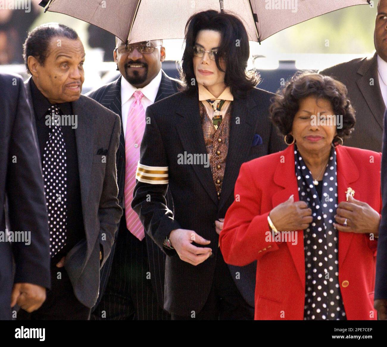 Michael Jackson (C), his father Joe Jackson (L) and mother Katherine ...
