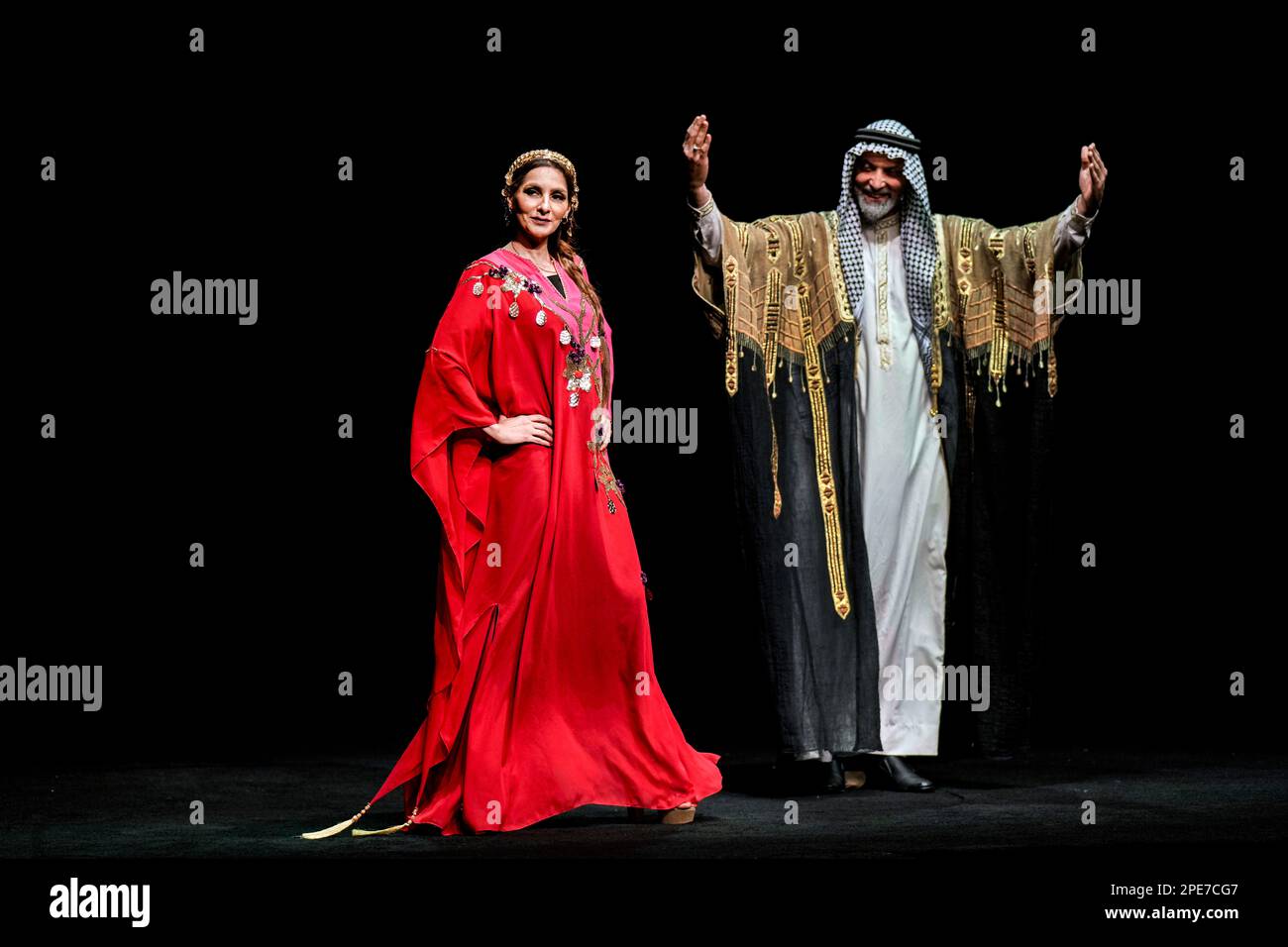 Models dressed in traditional Iraqi costumes dance in a fashion show at ...
