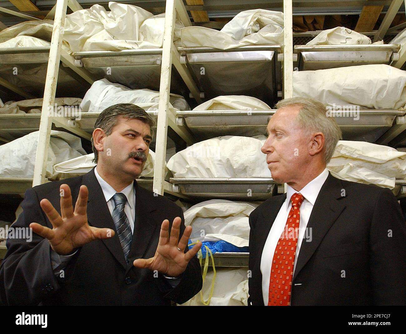Bosnian Amor Masovic, left, head of the Bosnian Commission on Missing ...