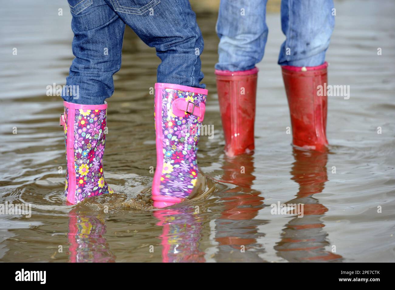Children playing in puddle, wearing colourful wellington boots, Great ...