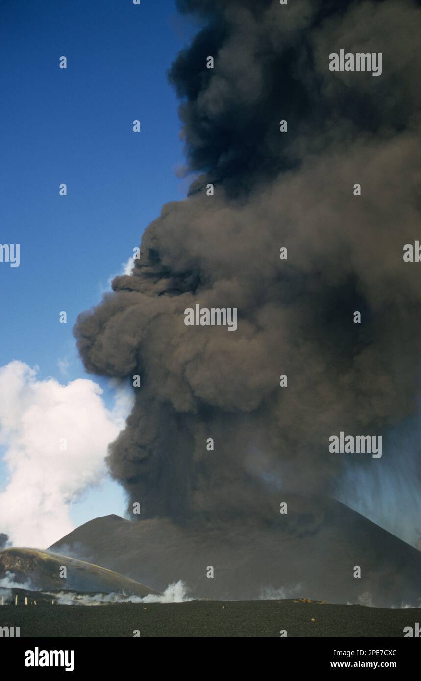 Rising column of smoke and ash from erupting volcano, Eldfell Volcano ...
