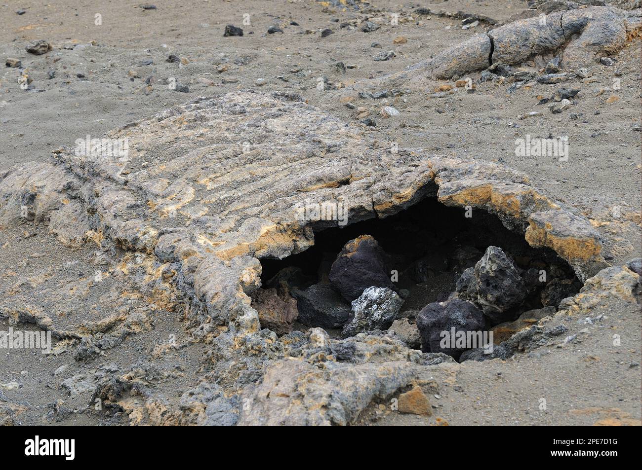 Lava tube formed when the outer layer of the lava flow cools and ...