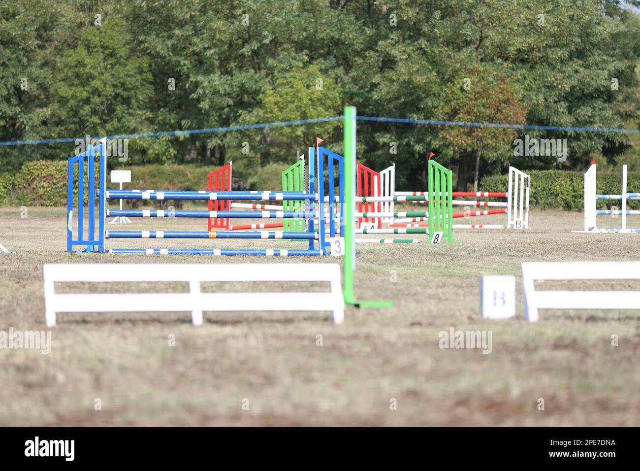 Show jumping poles obstacles, barriers, waiting for riders on show ...