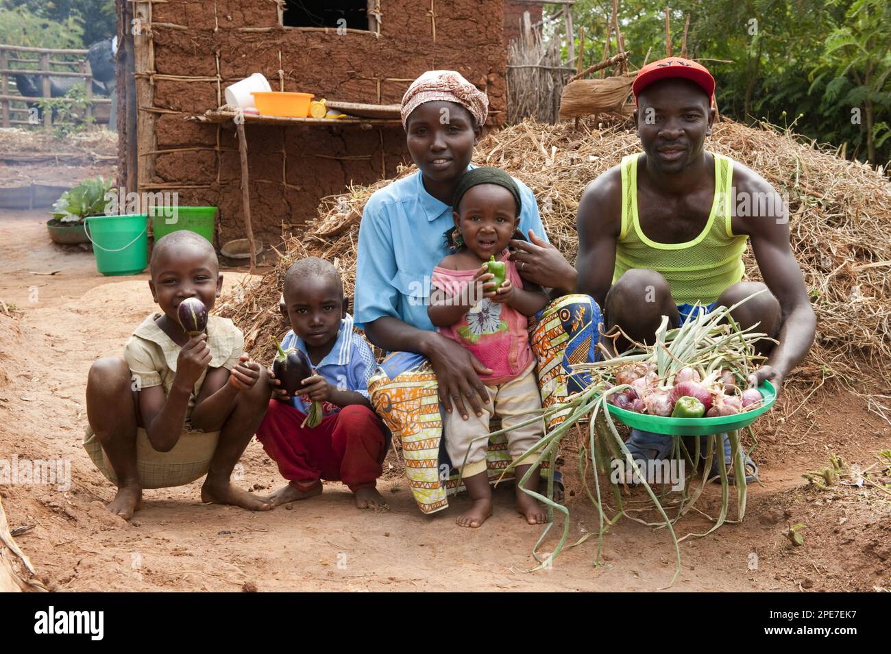 Family showing vegetables grown in the garden, Rwanda Stock Photo - Alamy