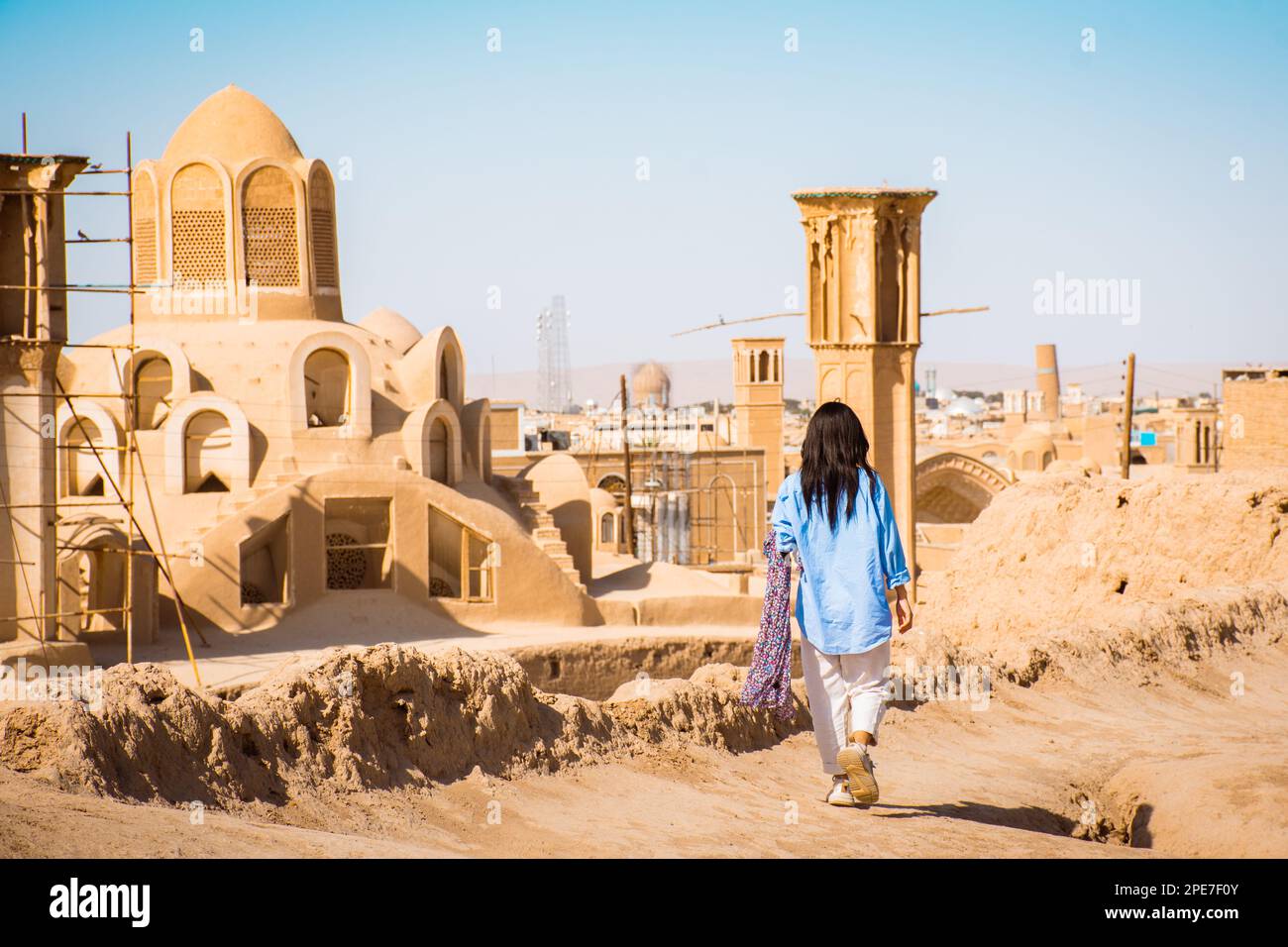 Woman tourist walk on rooftops with panorama from Historic castle in ...