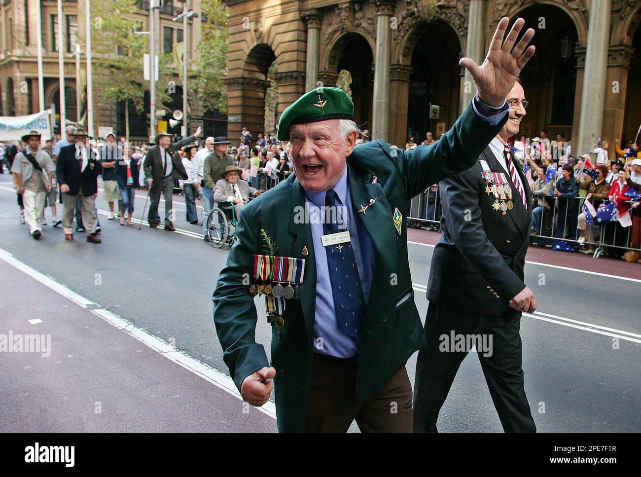 Brian Gerber waves to friends in the crowd as he marches up Sydney's ...