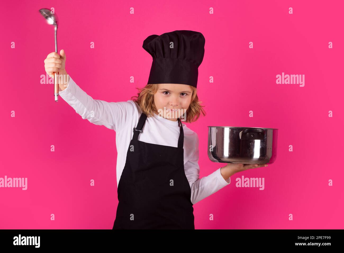 Child chef cook with cooking pot and ladle. Child wearing cooker ...