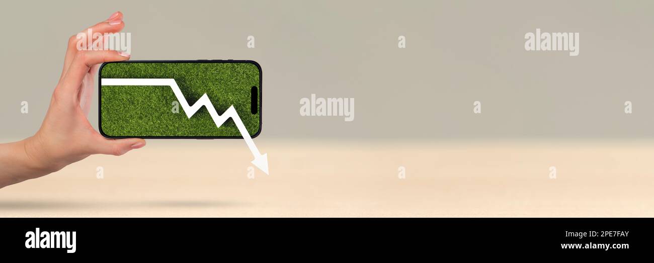 Recession and economic crisis.The hand holds the phone, on the screen ...