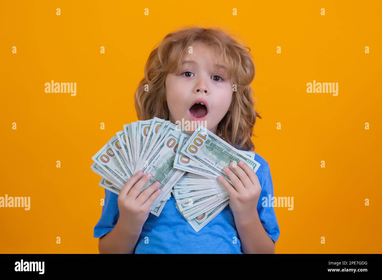 Happy rich kid boy with money dollars cash Stock Photo - Alamy