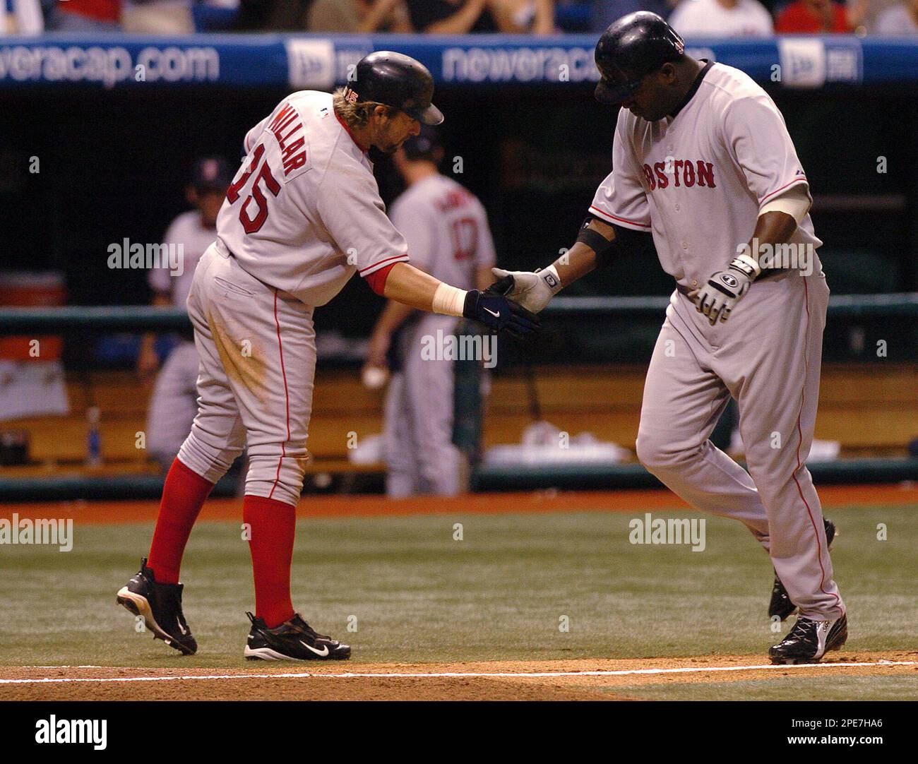 Boston Red Sox's Kevin Millar (15) congratulates David Ortiz after ...