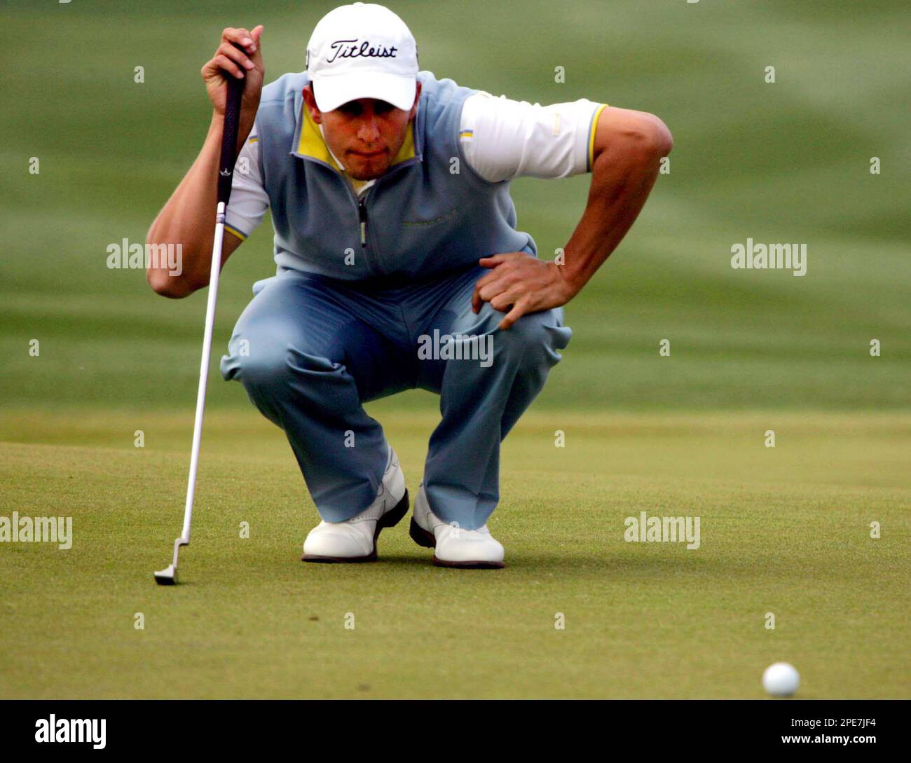 Australia's Adam Scott prepares to putt during his second round in the ...