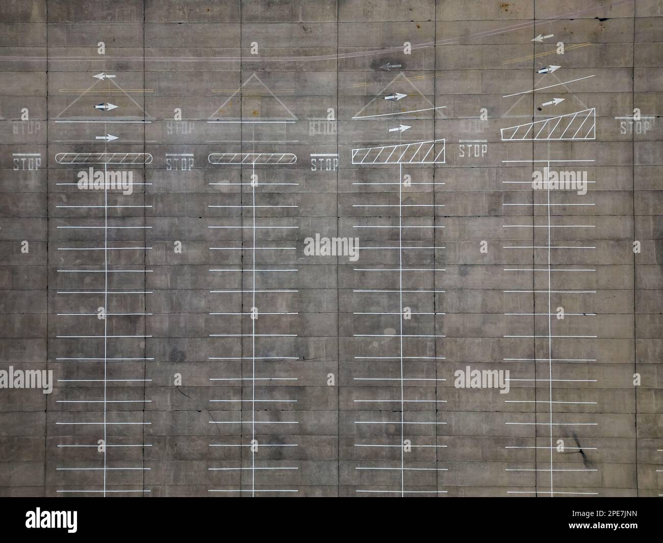 An aerial top view directly above an empty, paved parking lot on a ...