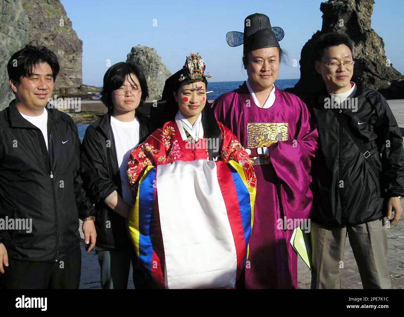 South Korean bridegroom Kim Jong-bok, second from right, 39, and bride ...