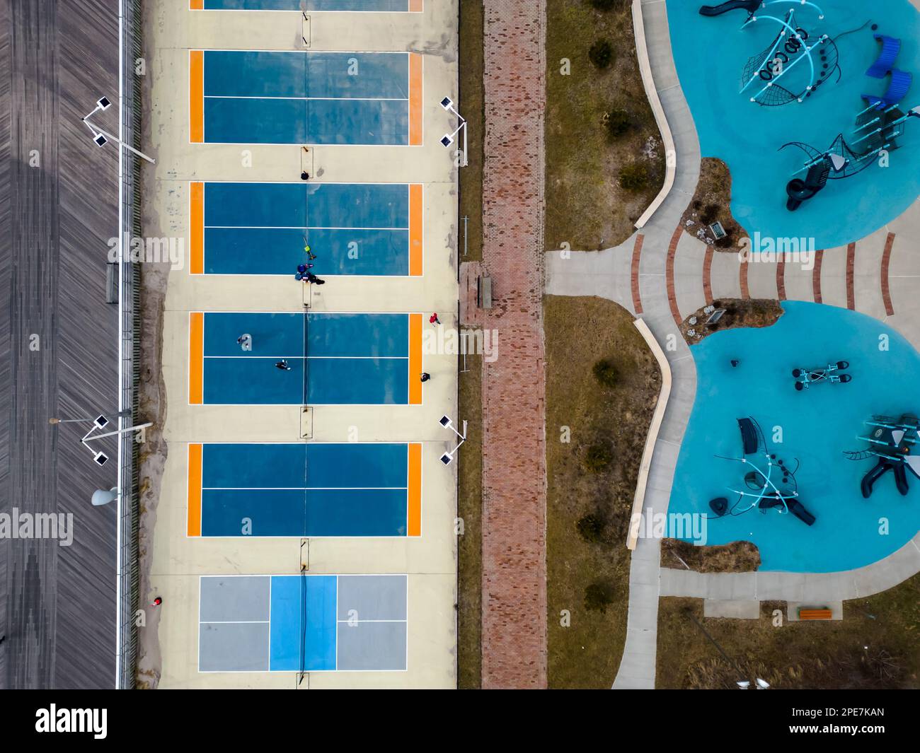 An aerial top view over an empty park with different ball courts for ...