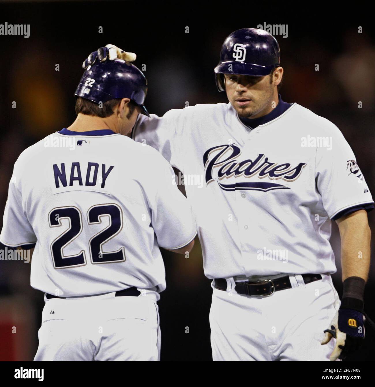 San Diego Padres' Ryan Klesko, right, taps teammate Xavier Nady on the ...