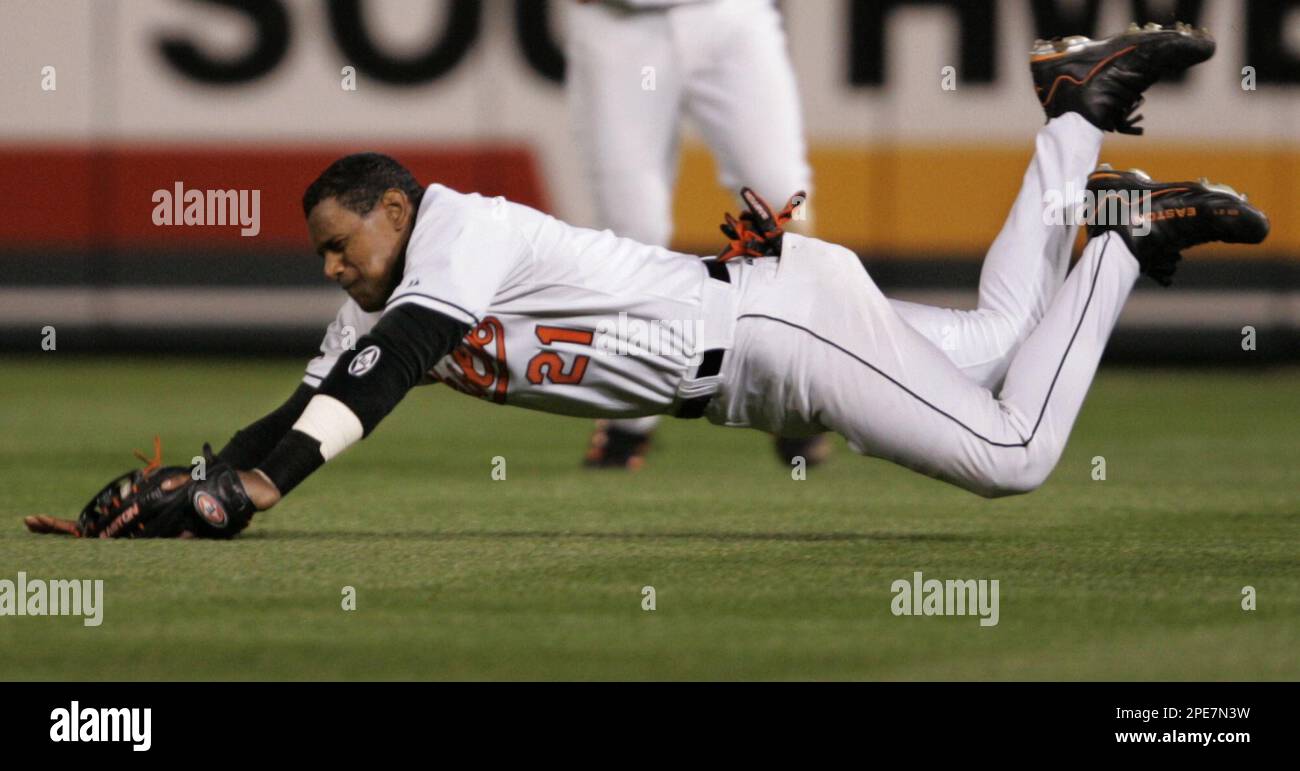 Baltimore Orioles right fielder Sammy Sosa makes a diving catch on a ...