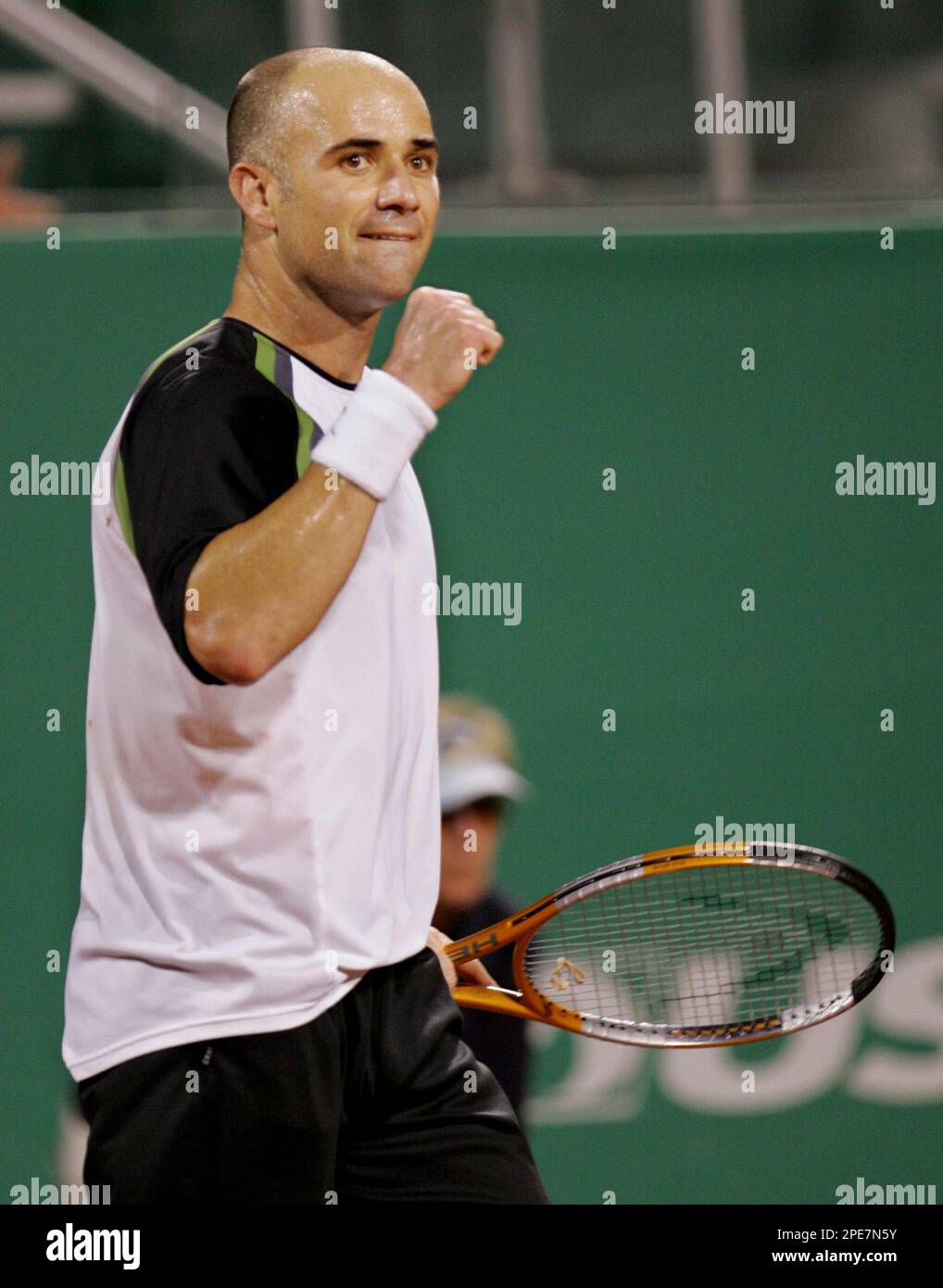 Second-seeded Andre Agassi pumps his fist after winning his first set ...