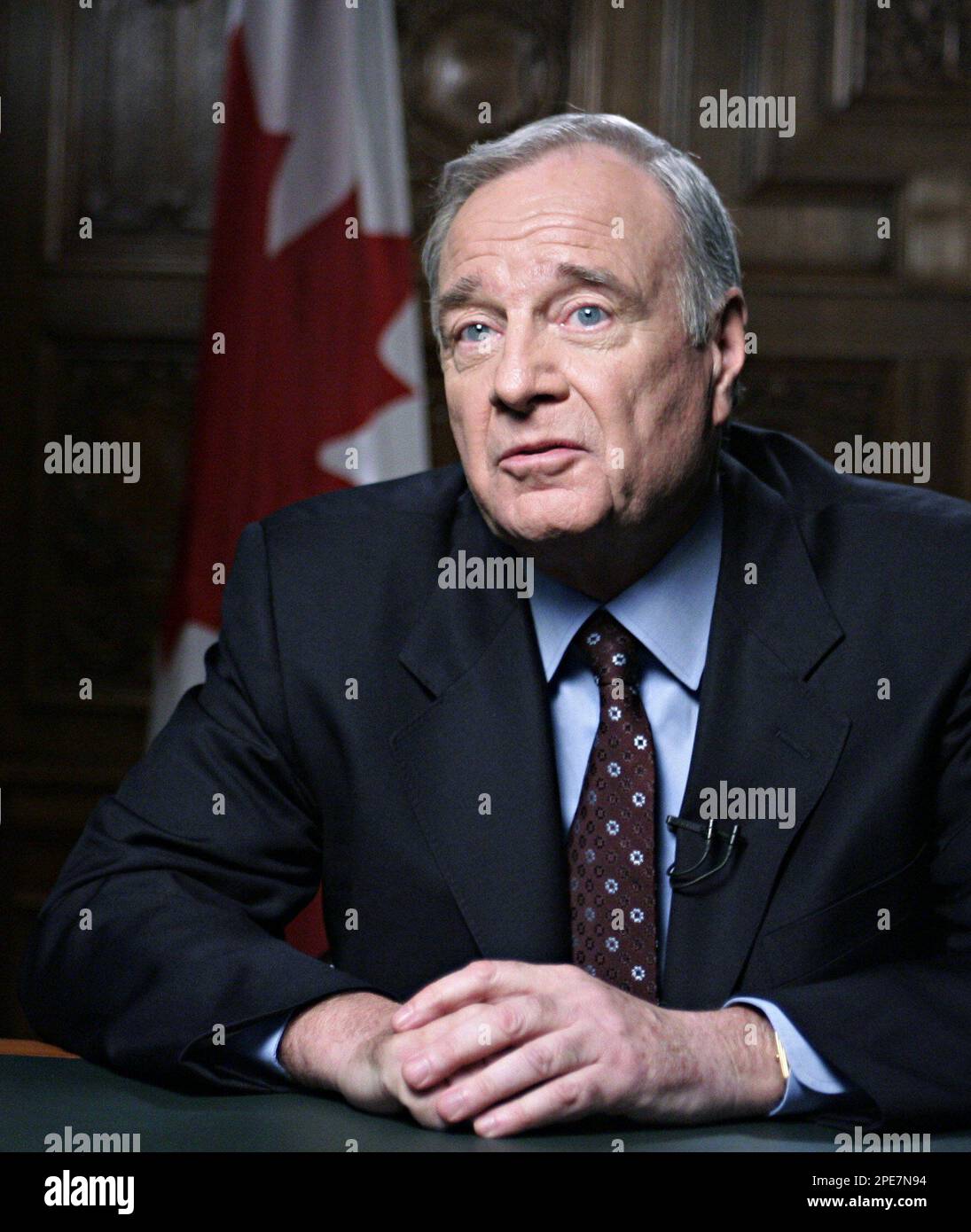 Prime Minister Paul Martin reads his address to the nation in his ...