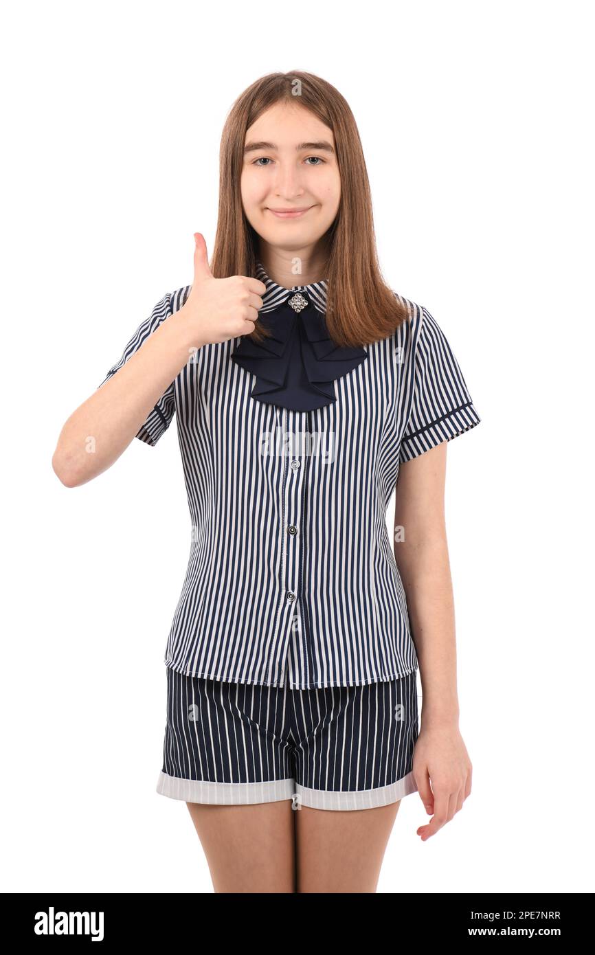 Young beautiful girl in a school uniform on a white background, smiling ...