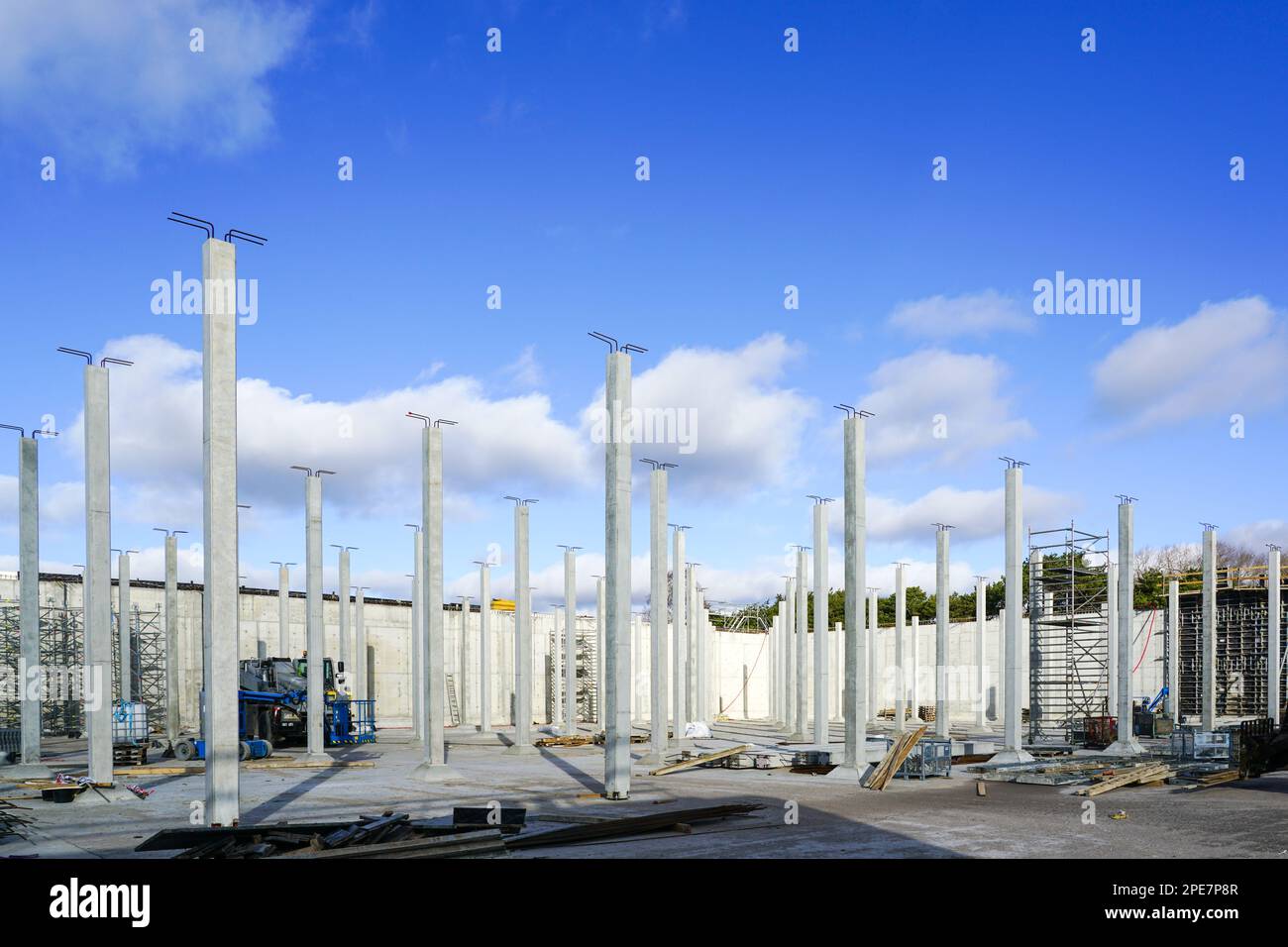 Many white vertical reinforced concrete columns at the construction ...