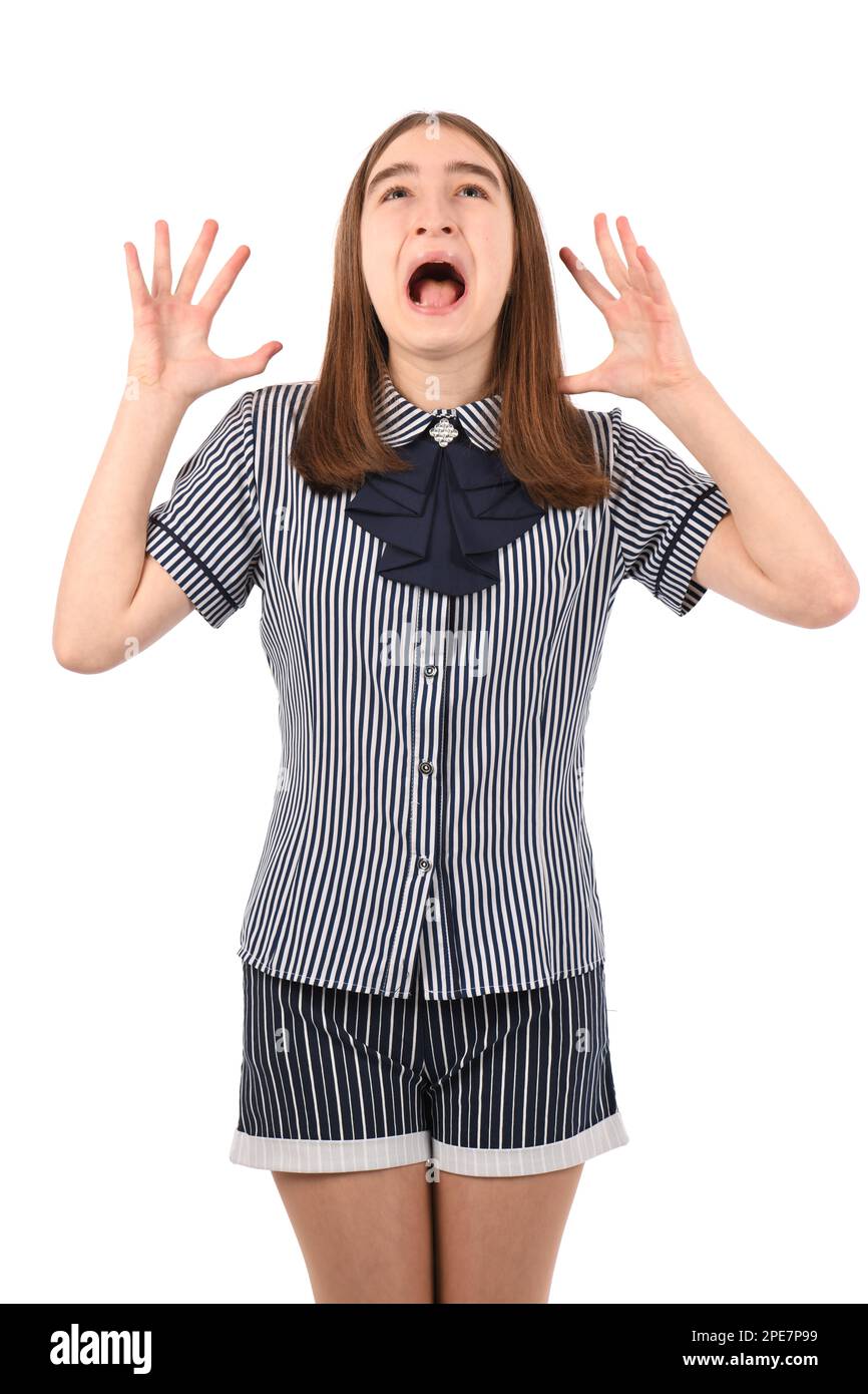 Young beautiful girl in a school uniform on a white background, crazy ...