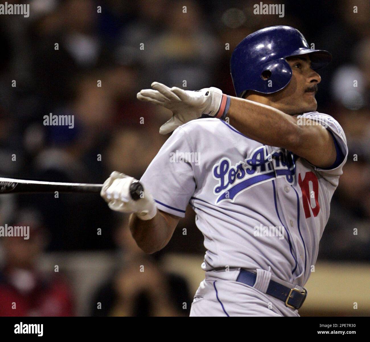 Los Angeles Dodgers' Jose Valentin watches his two-run triple to right ...