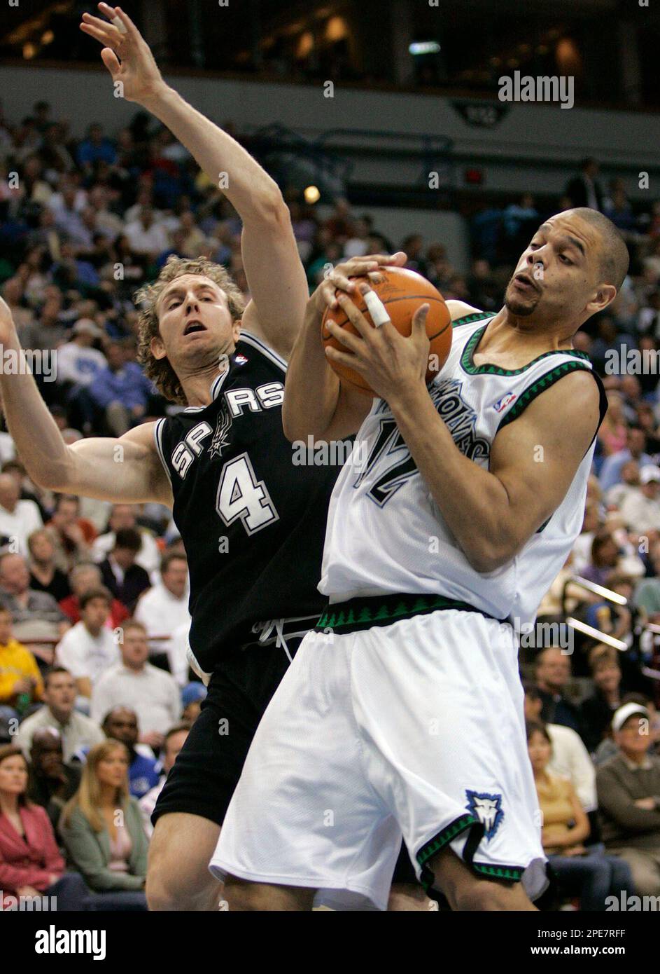 Minnesota Timberwolves forward John Thomas, right, pulls down a rebound ...