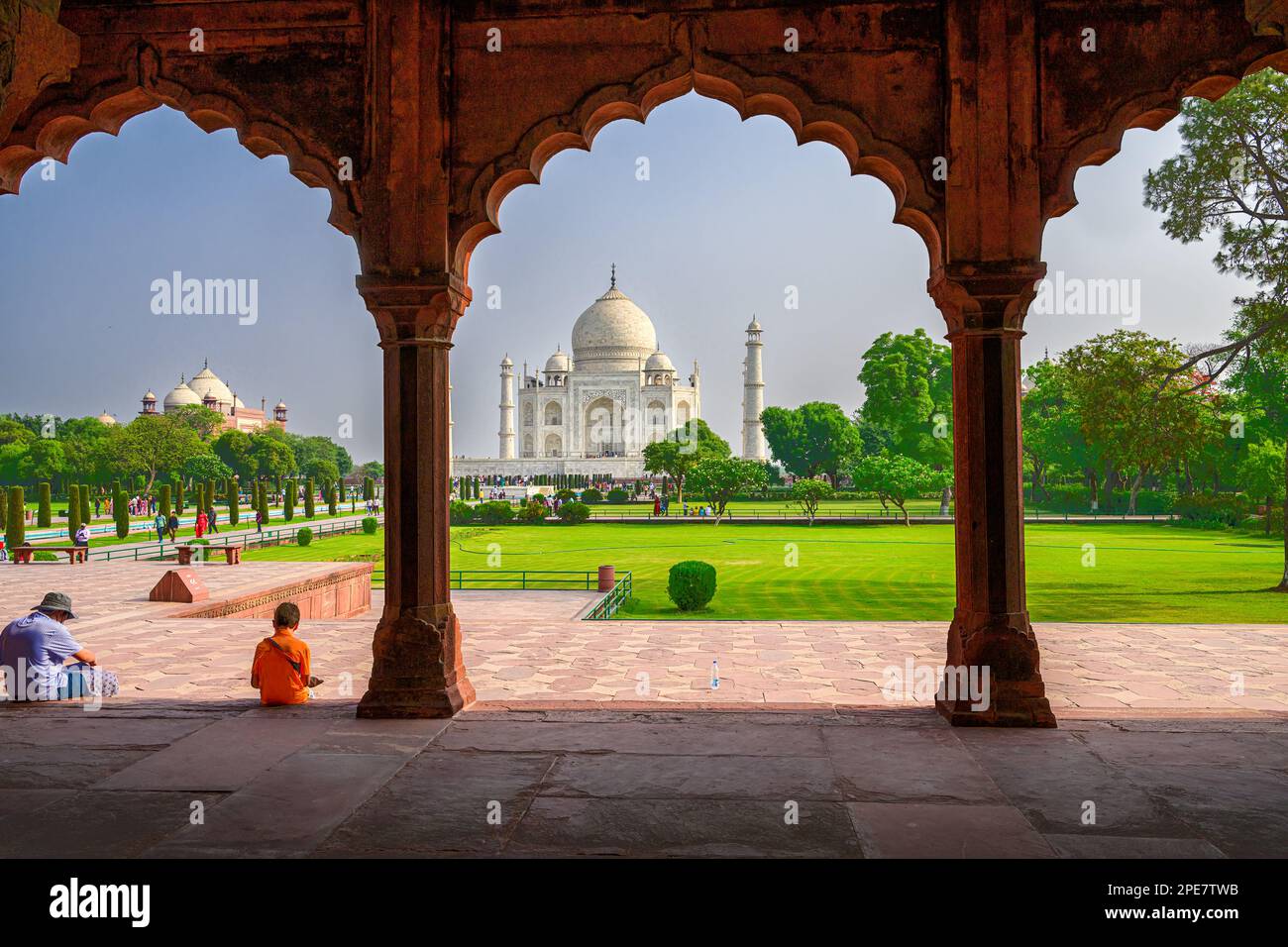 Taj Mahal and the charbagh garden viewed through the cusped arches of ...