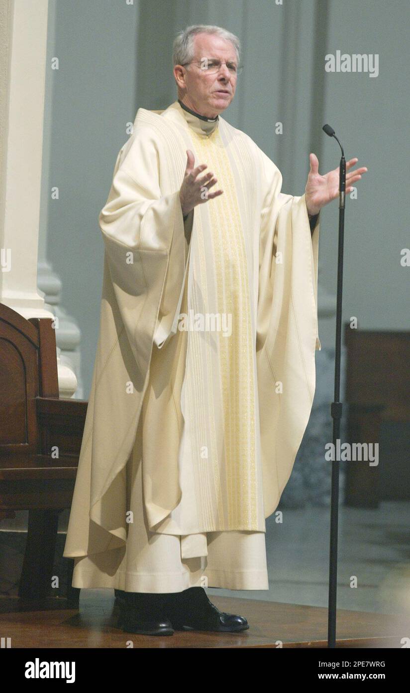 Rev. Michael G. Ryan, center, pastor of St. James Cathedral in Seattle ...