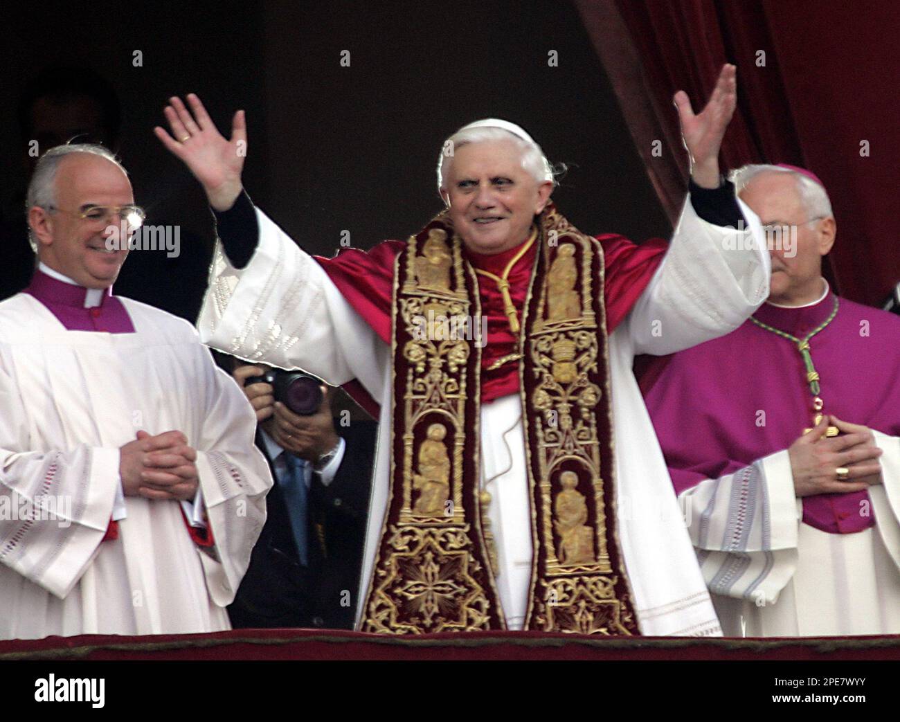 Newly elected Pope Benedict XVI waves to the crowd from a balcony of St ...