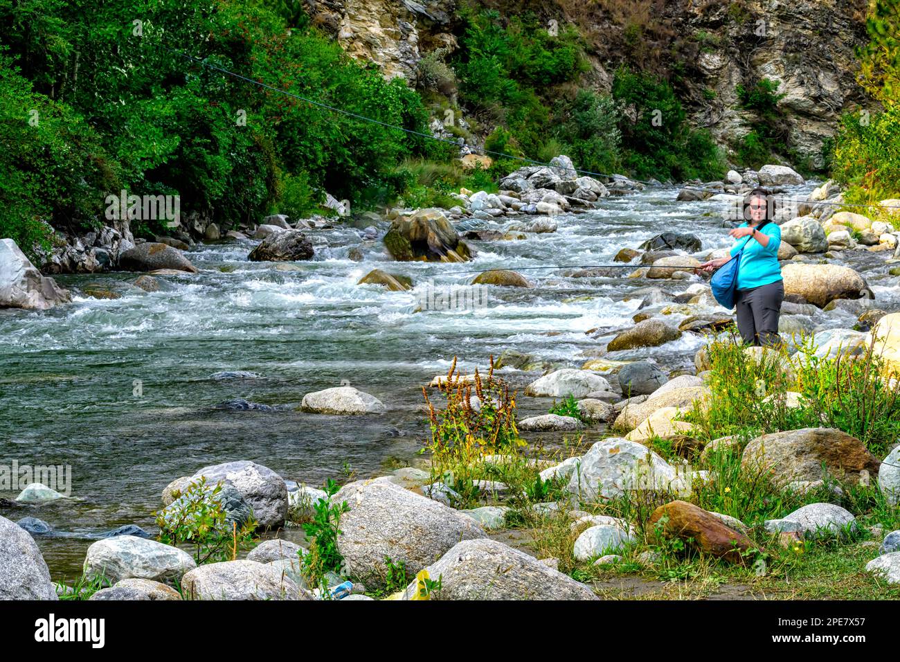 Fishing for Trout in the Himalaya mountains along the Tirthan River ...