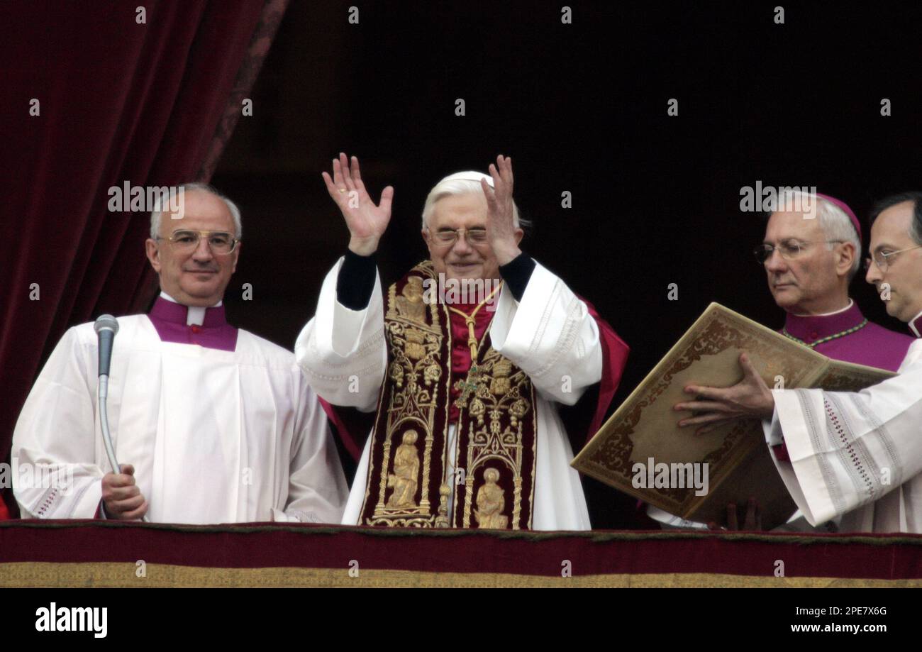 Newly elected Pope Benedict XVI waves to the crowd from the central ...