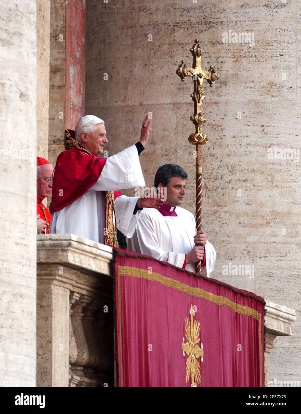 Pope Benedict XVI blesses the crowd from the central balcony of St ...