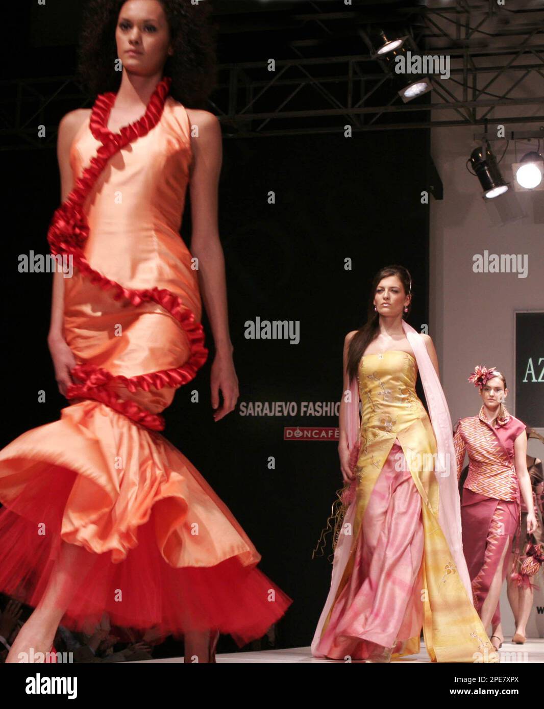 Models present outfits designed by Bosnian designers during the ...