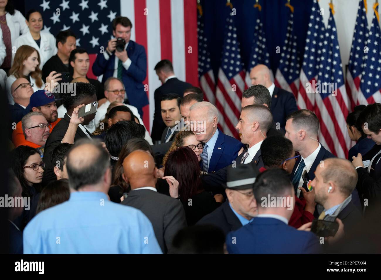 President Joe Biden greets people after speaking about health care and ...