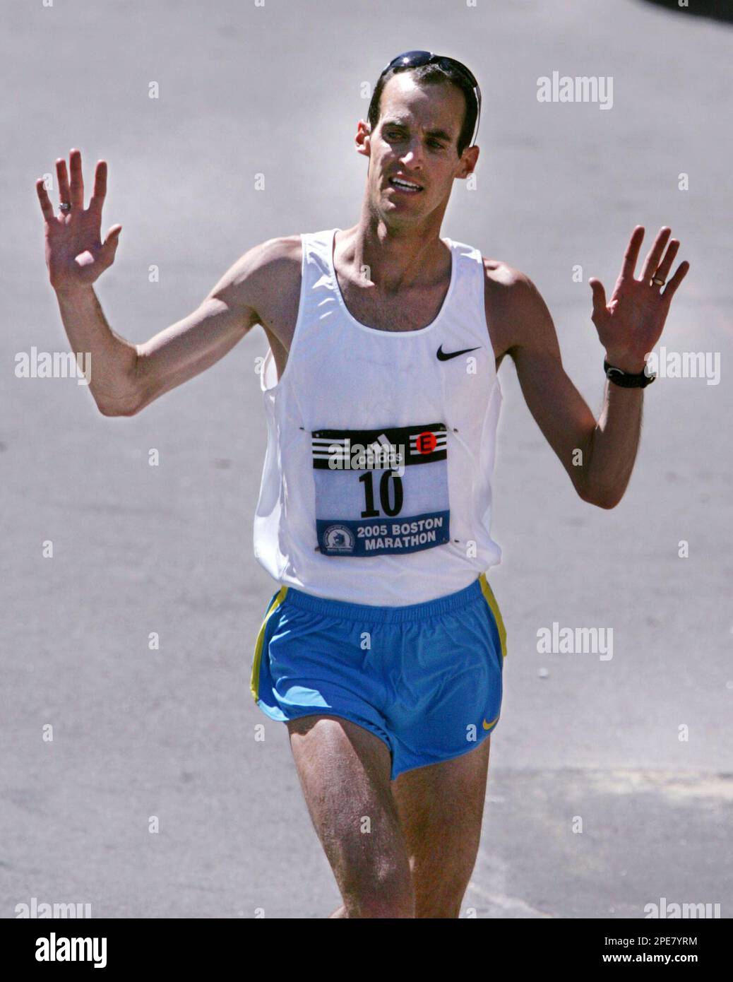 Alan Culpepper of Lafayette, Colo. raises his arms as he approaches the ...