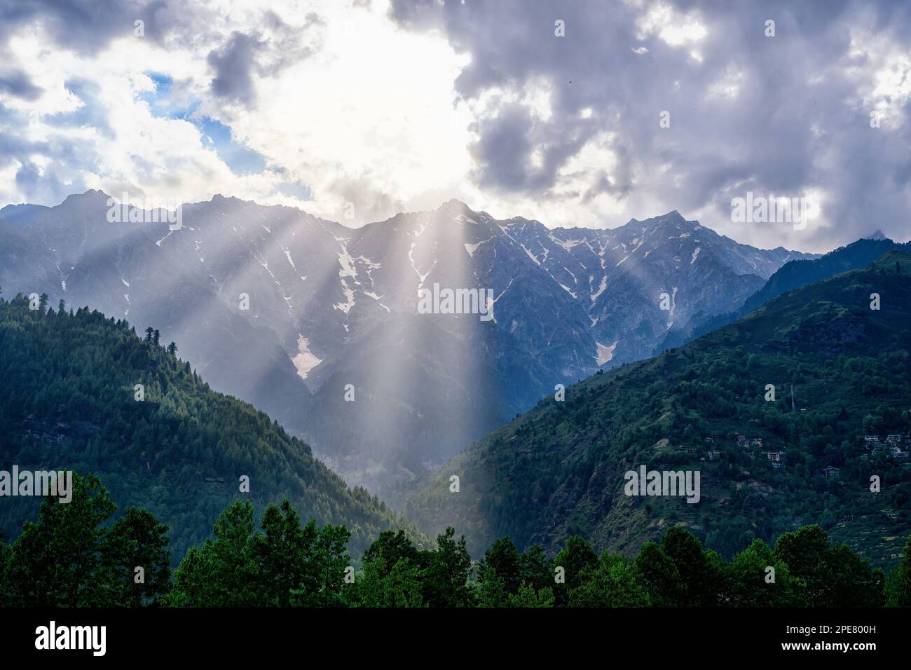 Sun breaks through the clouds in Solang Valley along the Beas River ...